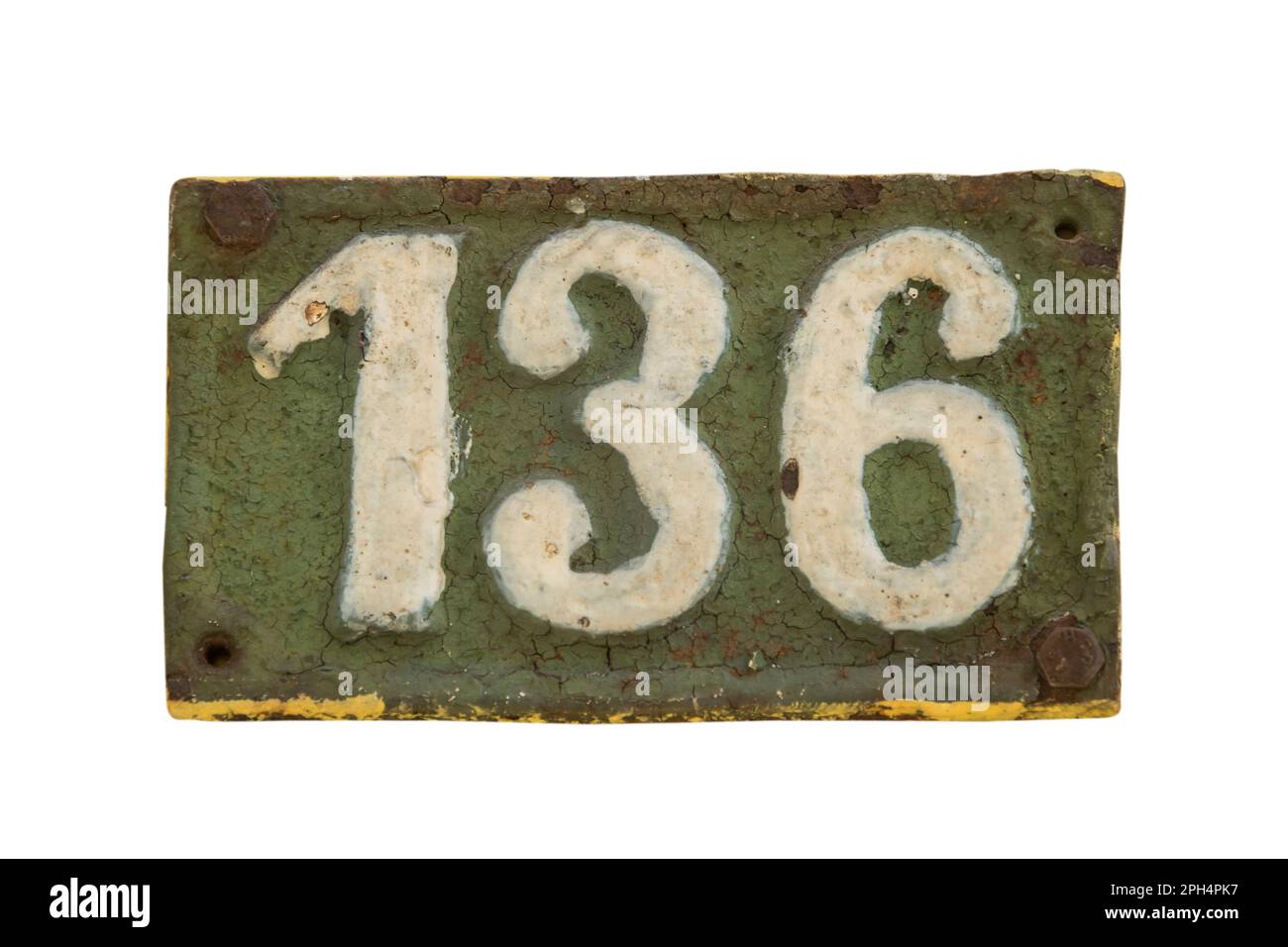 Old retro weathered cast iron plate with number 136 closeup isolated on ...