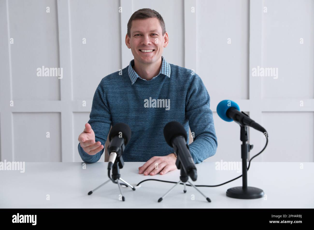 Business man giving interview at official event Stock Photo - Alamy