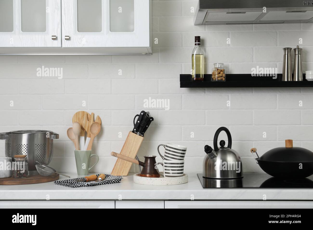 Countertop with different cooking utensils in kitchen Stock Photo - Alamy