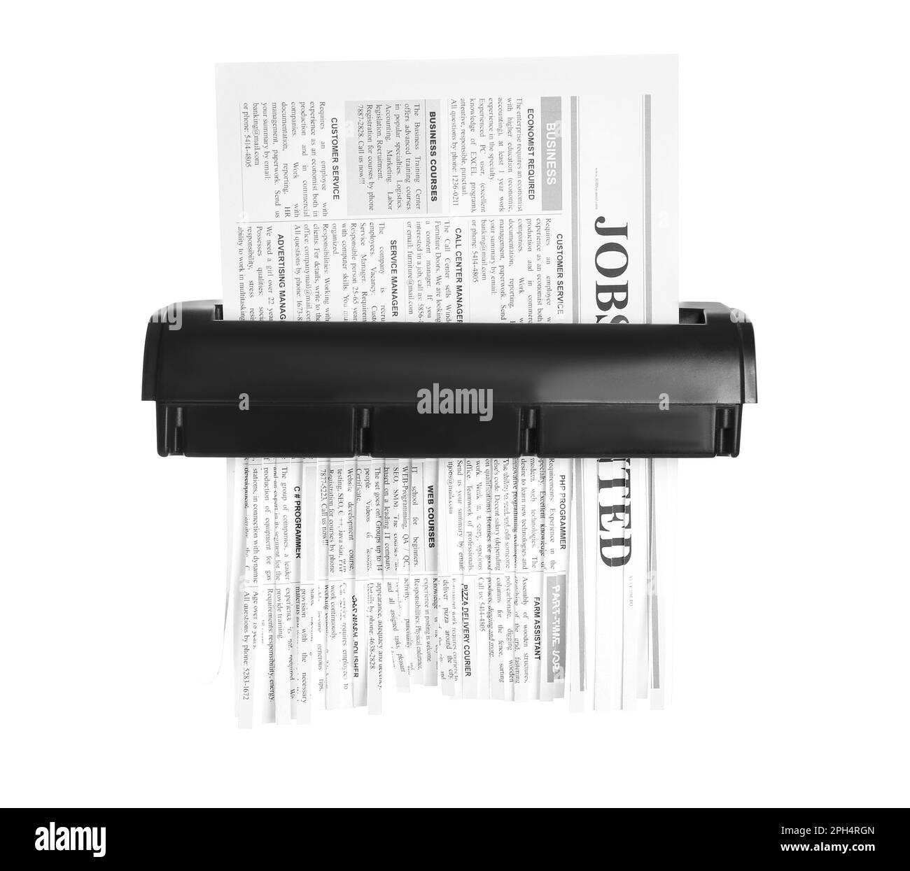 Destroying newspaper with shredder on white background Stock Photo - Alamy