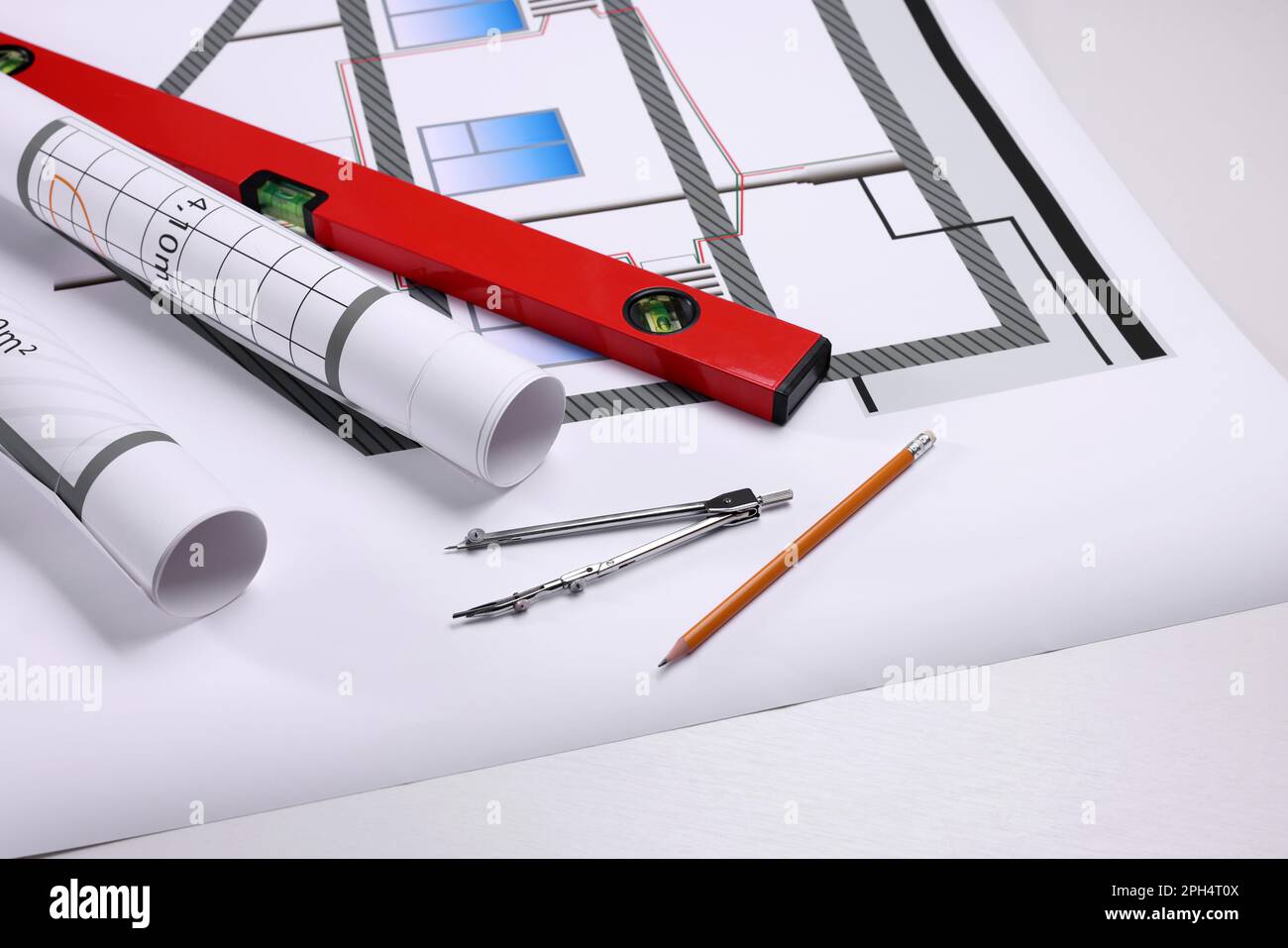 Construction drawings, pair of compasses, pencil and bubble level on white background Stock ...