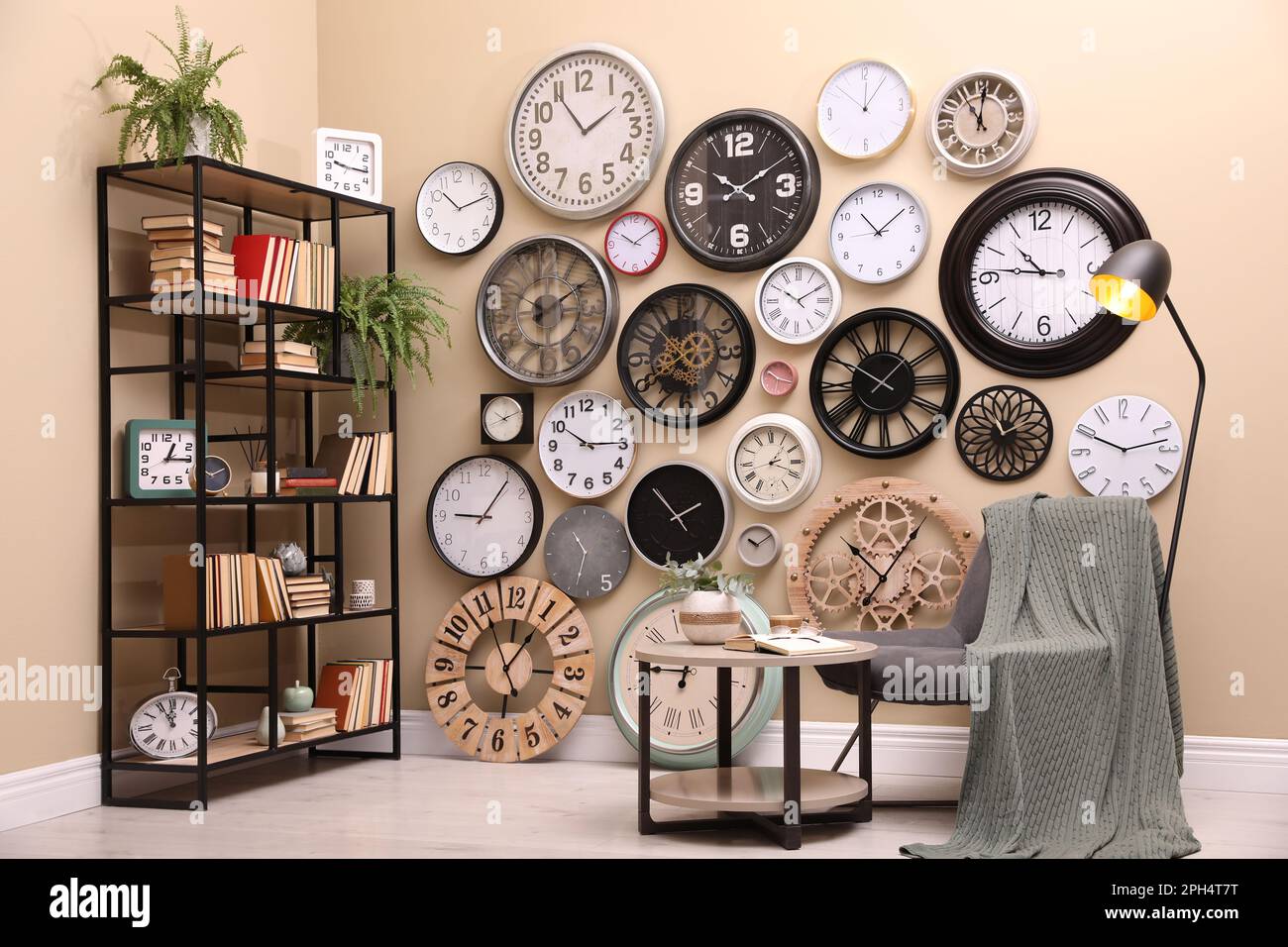 Stylish room interior with collection of wall clocks Stock Photo - Alamy
