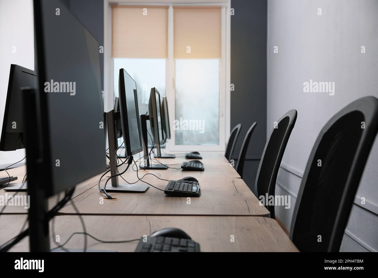 Rows of computers in empty office hi-res stock photography and images ...