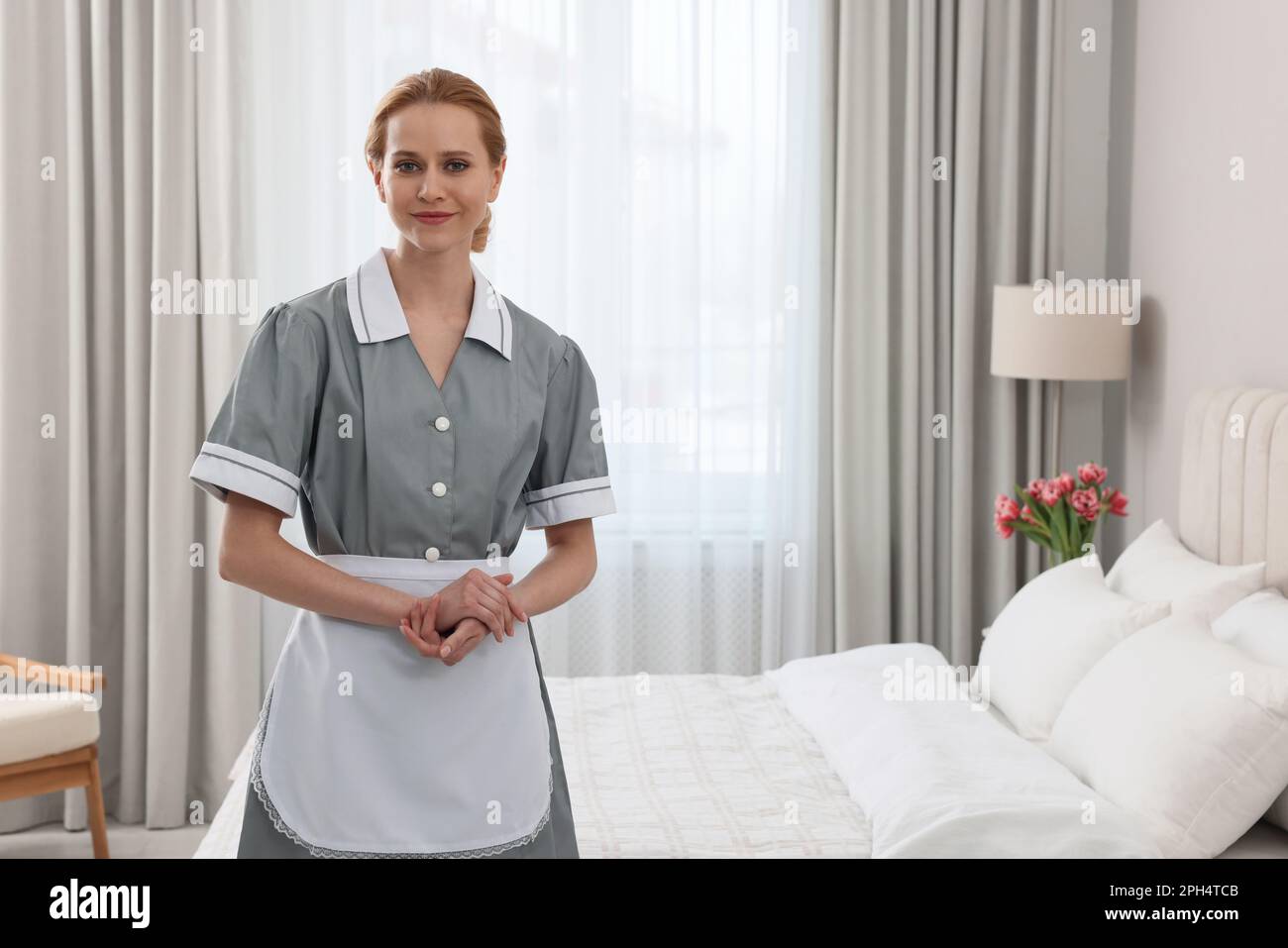 Female hotel housekeeper in uniform hi-res stock photography and images ...