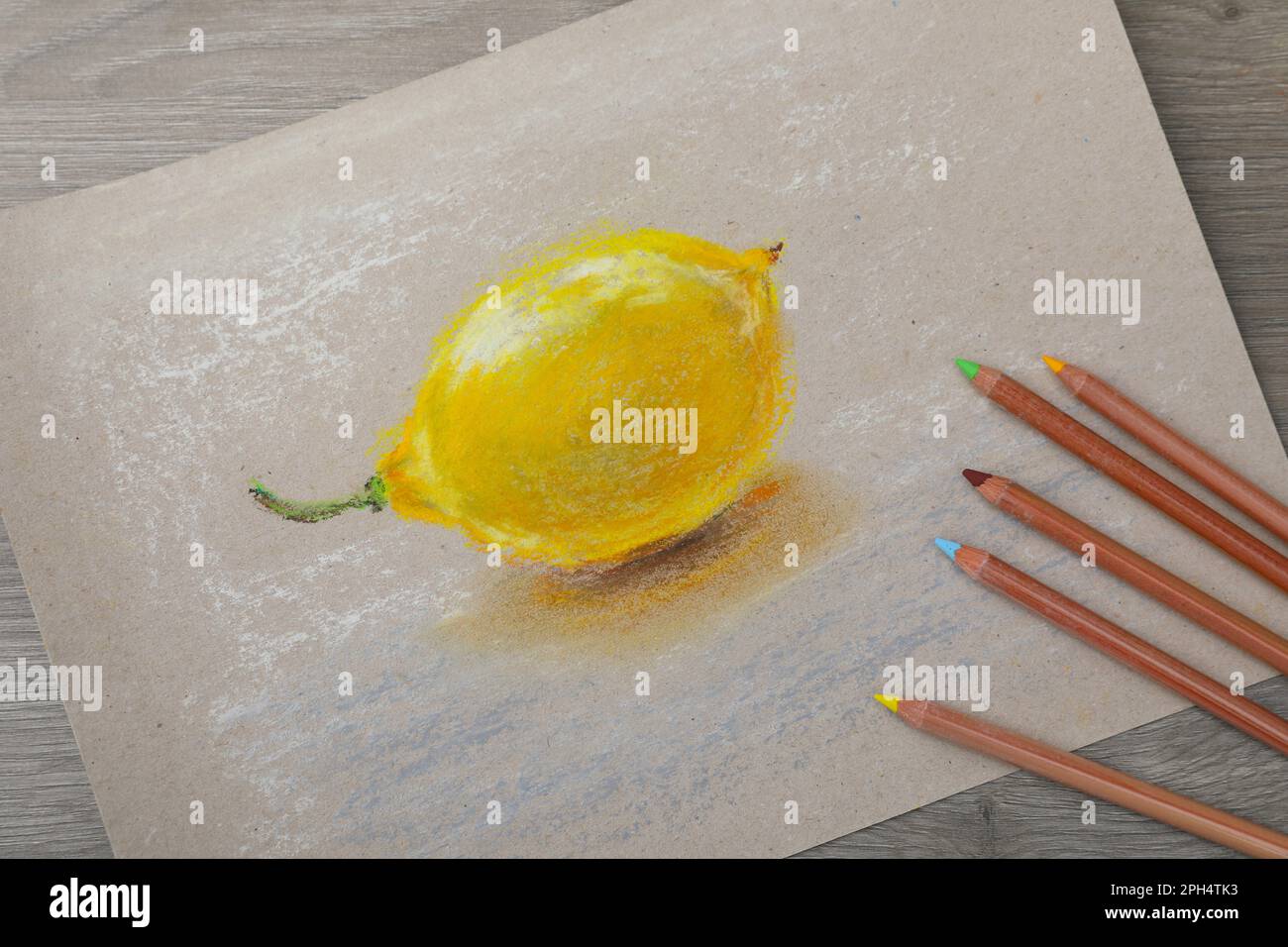 Beautiful drawing of lemon and color pencils on wooden table, flat lay ...