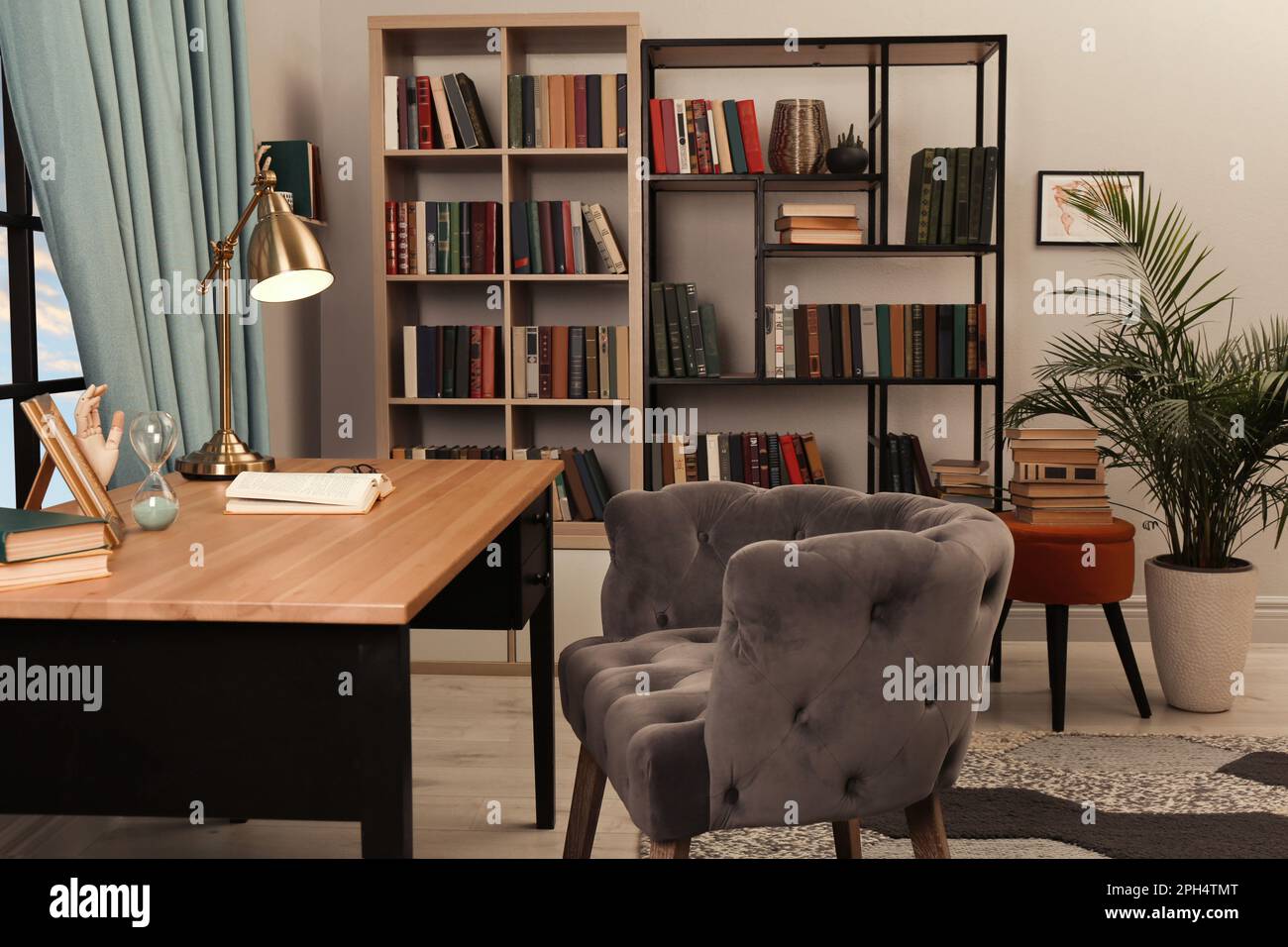 Cozy home library interior with collection of different books on ...