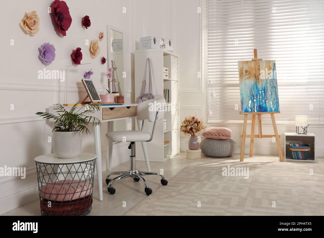 Stylish teenager's room interior with computer and painting easel Stock ...