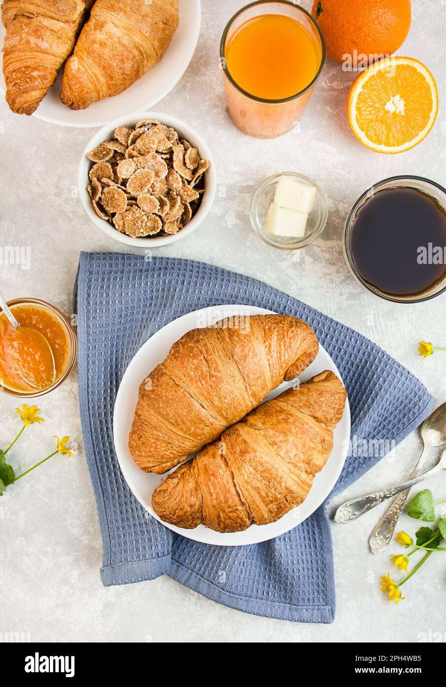 Fresh croissants with jam and coffee. European breakfast on a light ...
