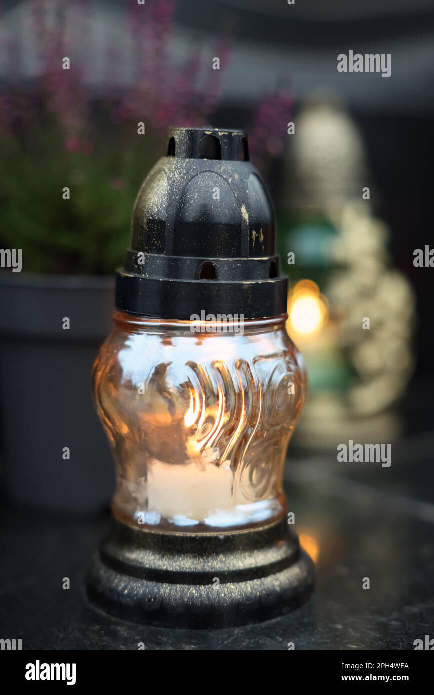 Grave light on granite surface at cemetery, closeup Stock Photo - Alamy