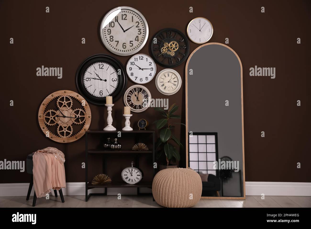 Stylish room interior with collection of wall clocks Stock Photo - Alamy
