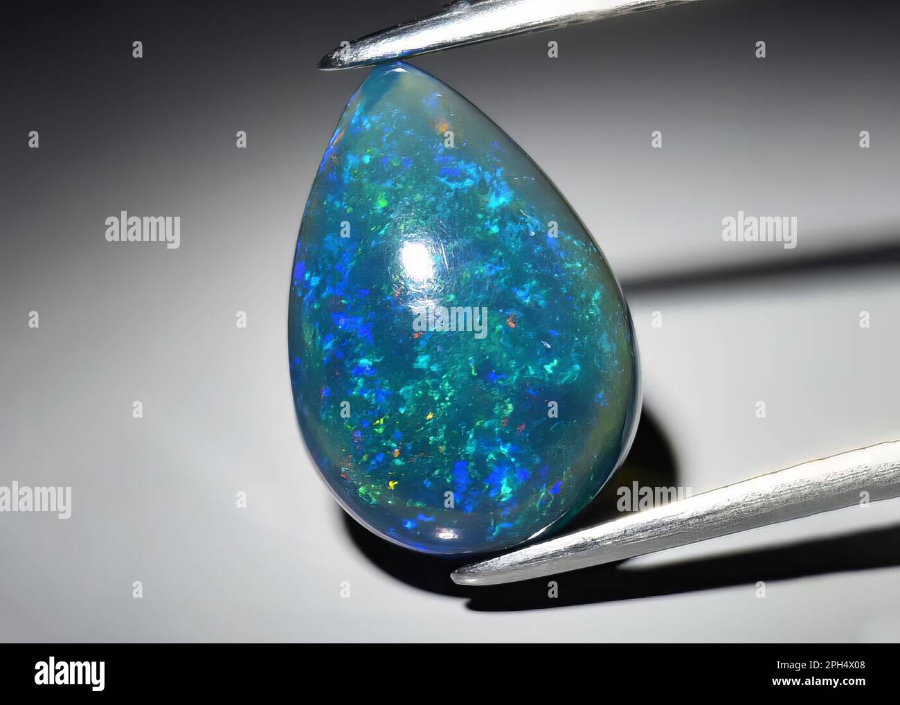 Natural precious stone noble opal on a black background Stock Photo - Alamy