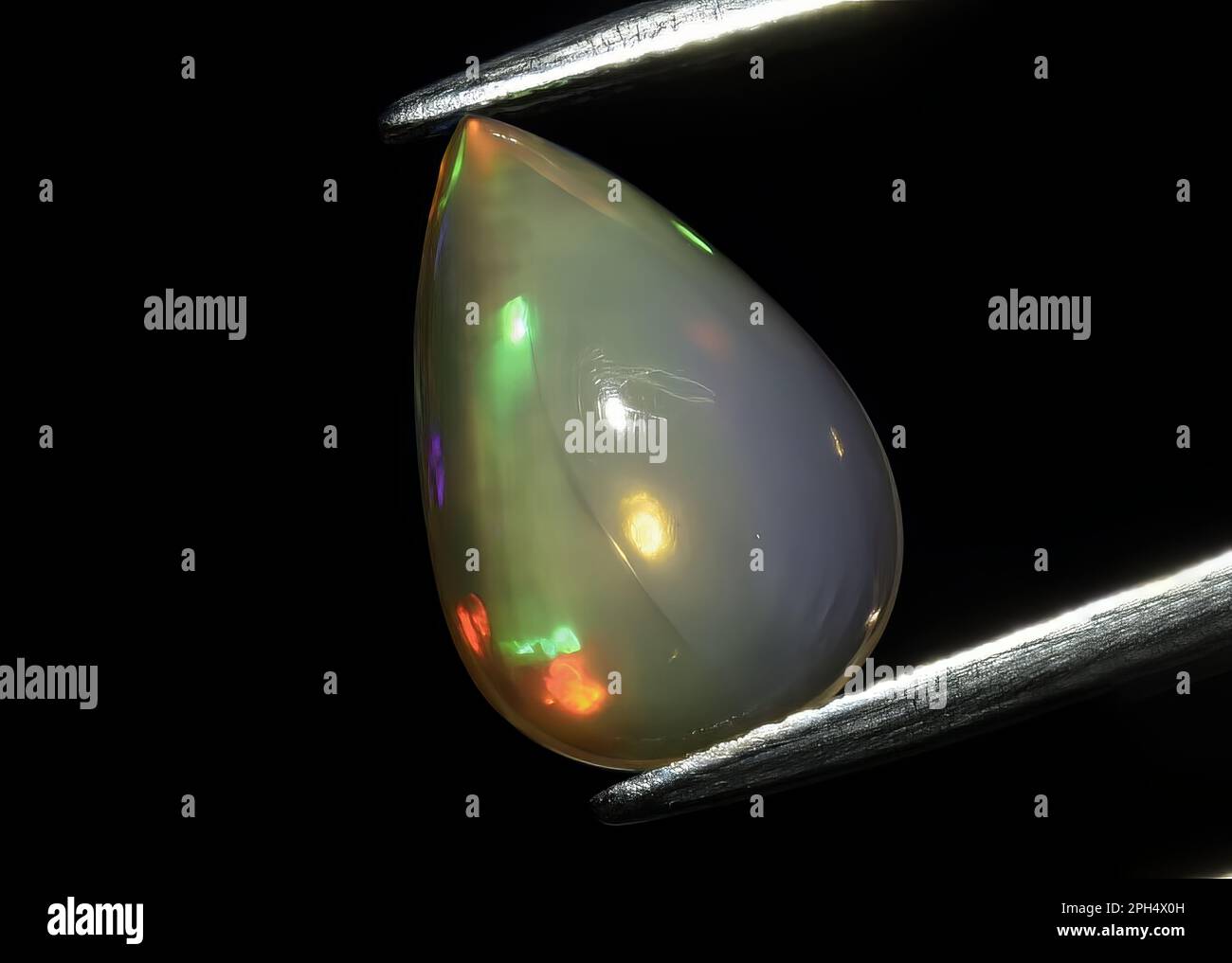 Natural precious stone noble opal on a black background Stock Photo - Alamy