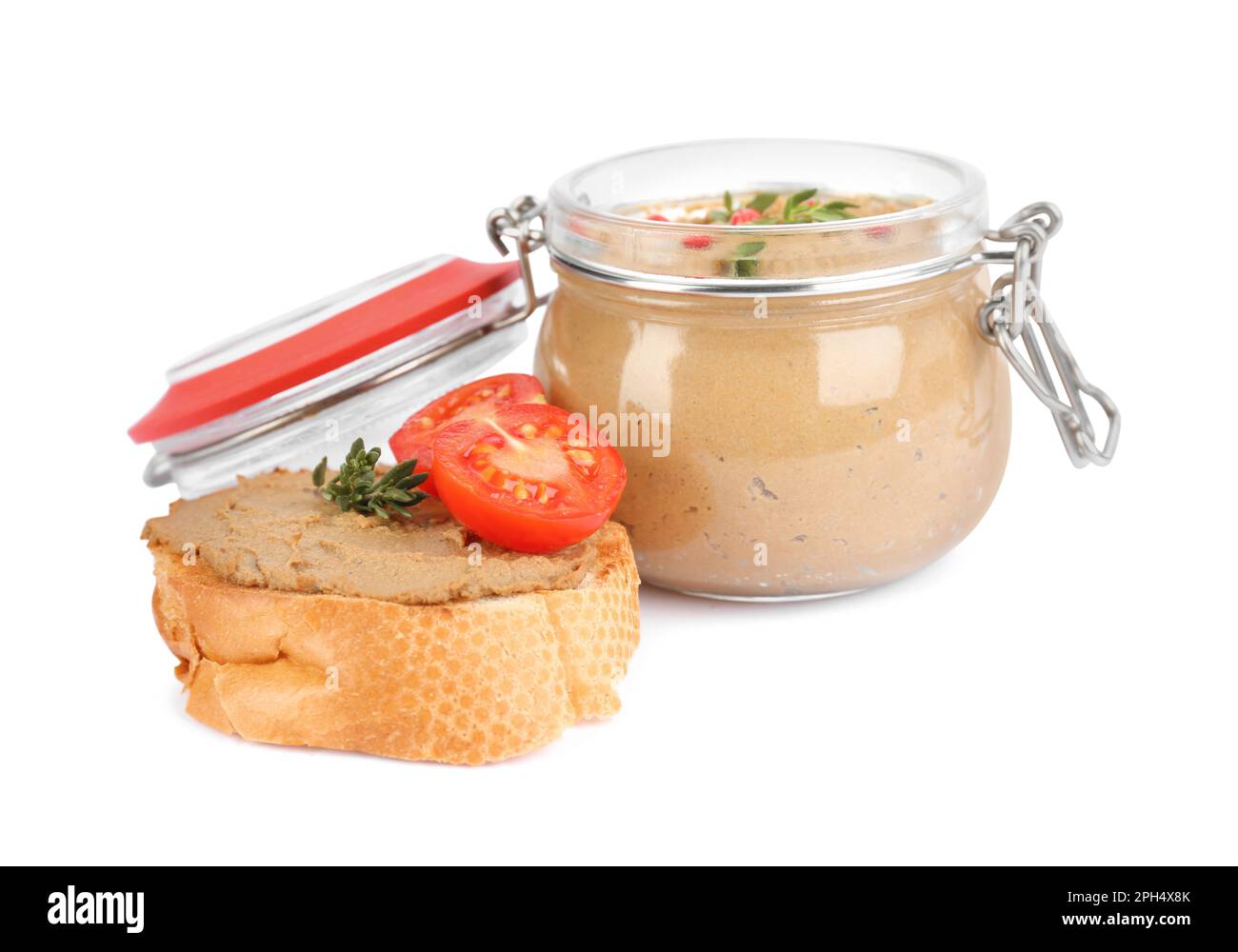 Fresh bread and glass jar with delicious liver pate on white background ...