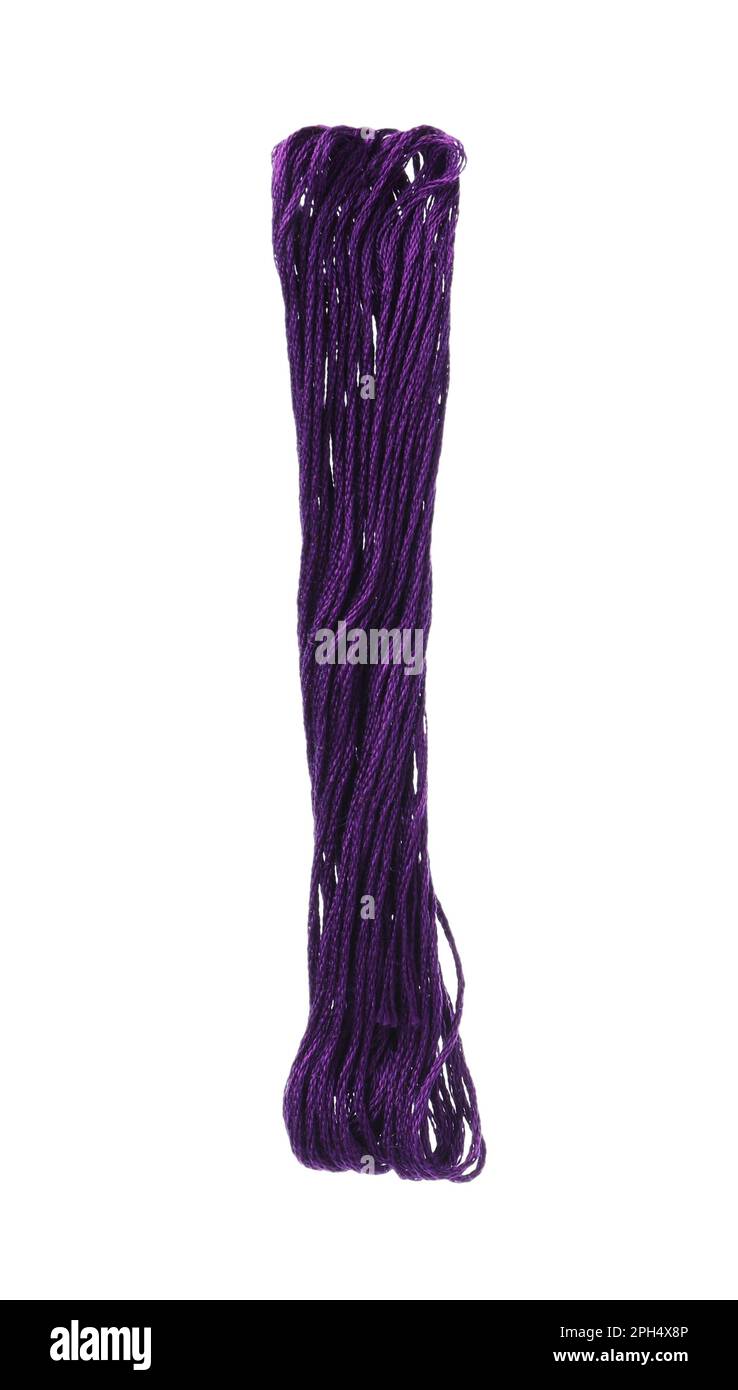 Bright purple embroidery thread on white background Stock Photo - Alamy