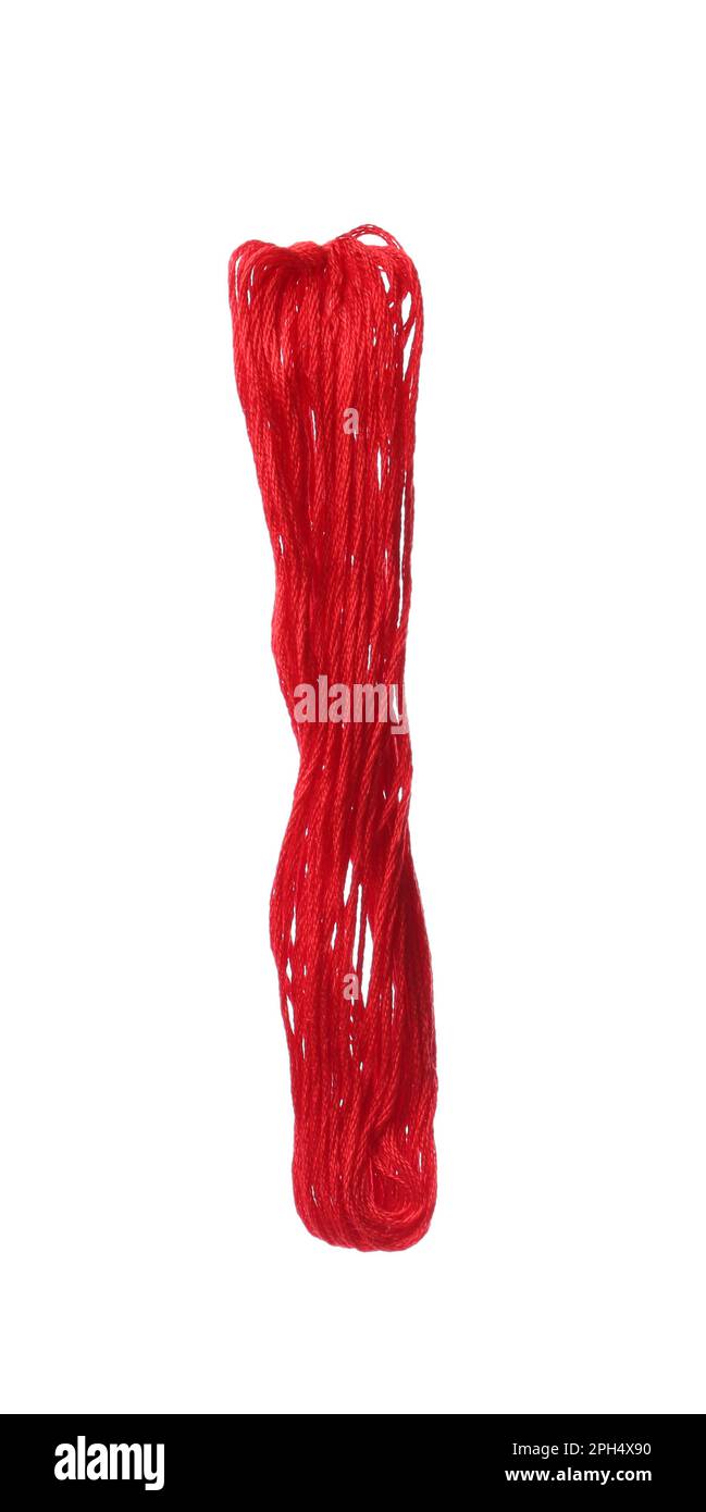 Bright red embroidery thread on white background Stock Photo - Alamy