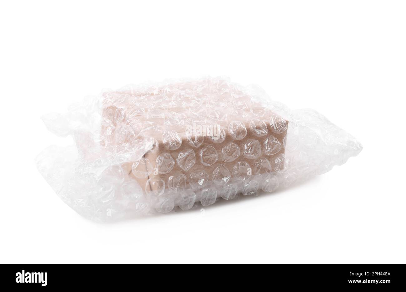 Cardboard box packed in bubble wrap isolated on white Stock Photo - Alamy