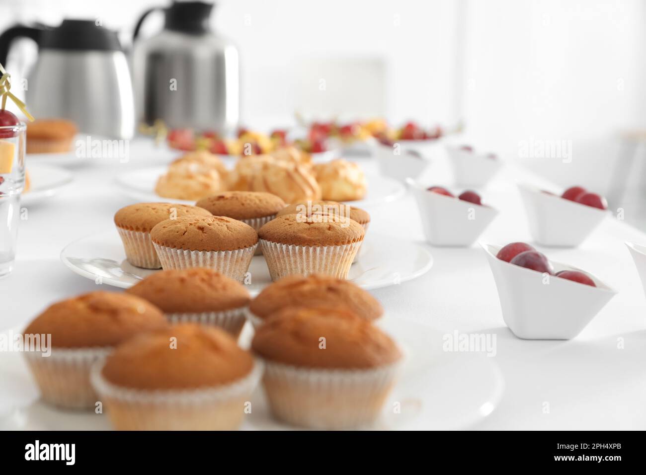 Table with different delicious snacks indoors. Coffee break Stock Photo ...