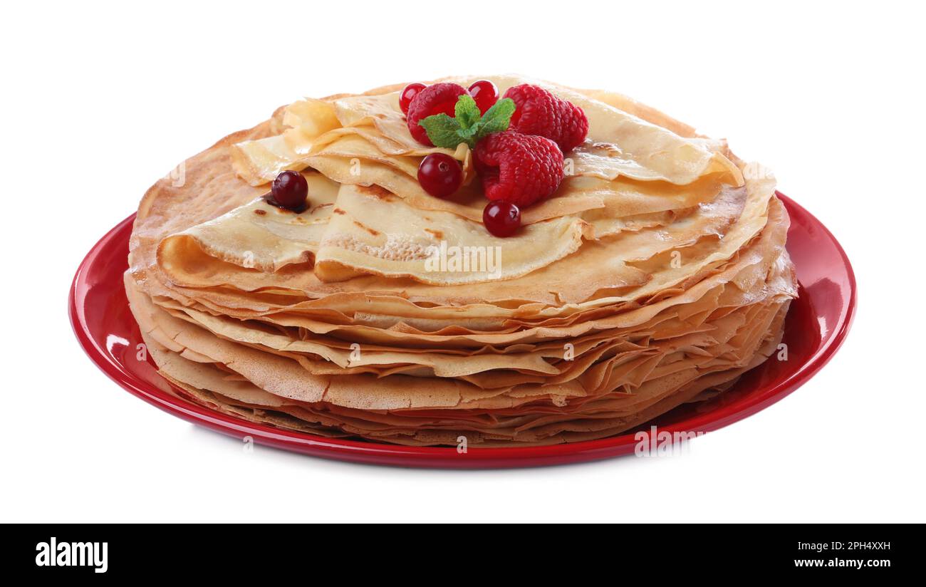Delicious crepes with berries and mint on white background Stock Photo ...