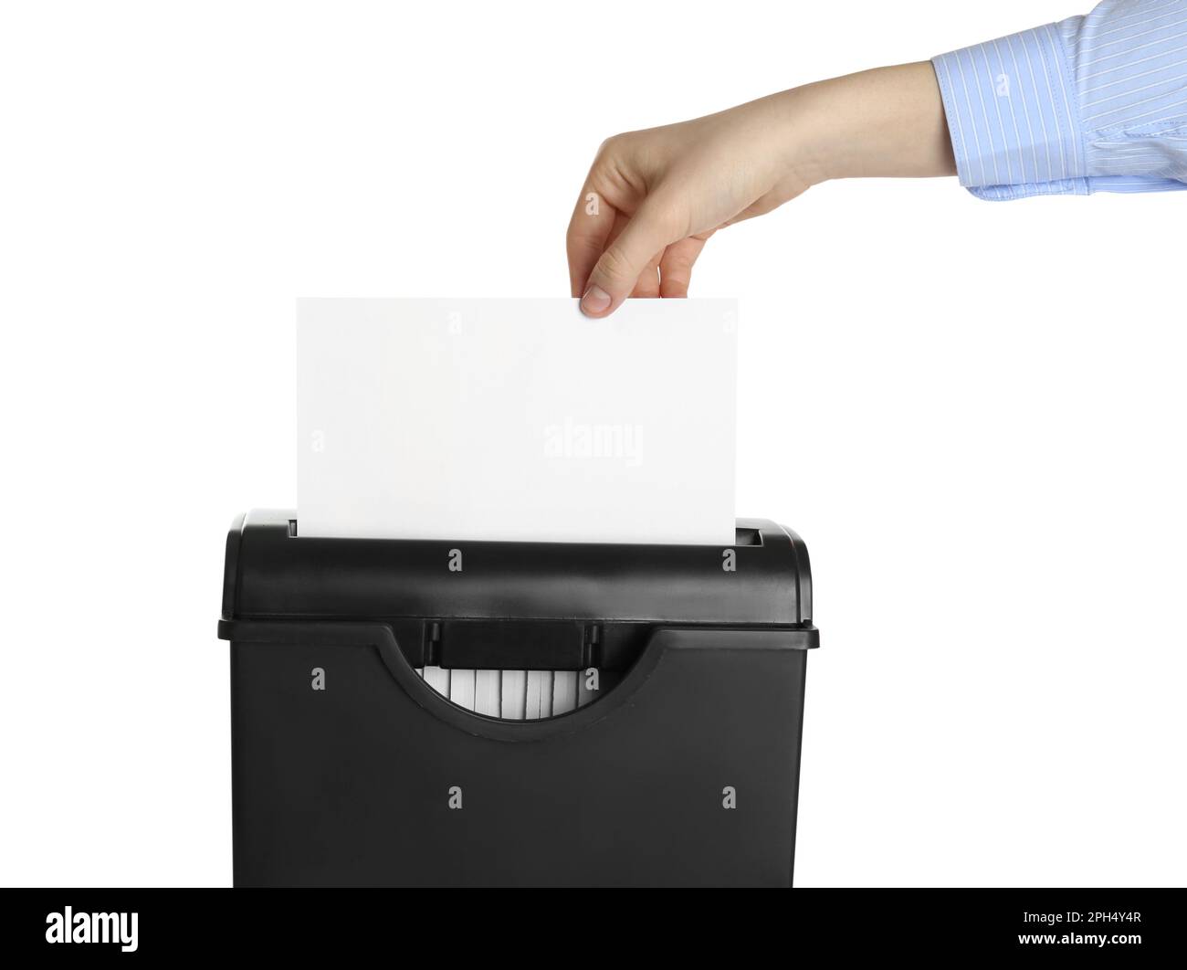 Woman destroying sheet of paper with shredder on white background ...