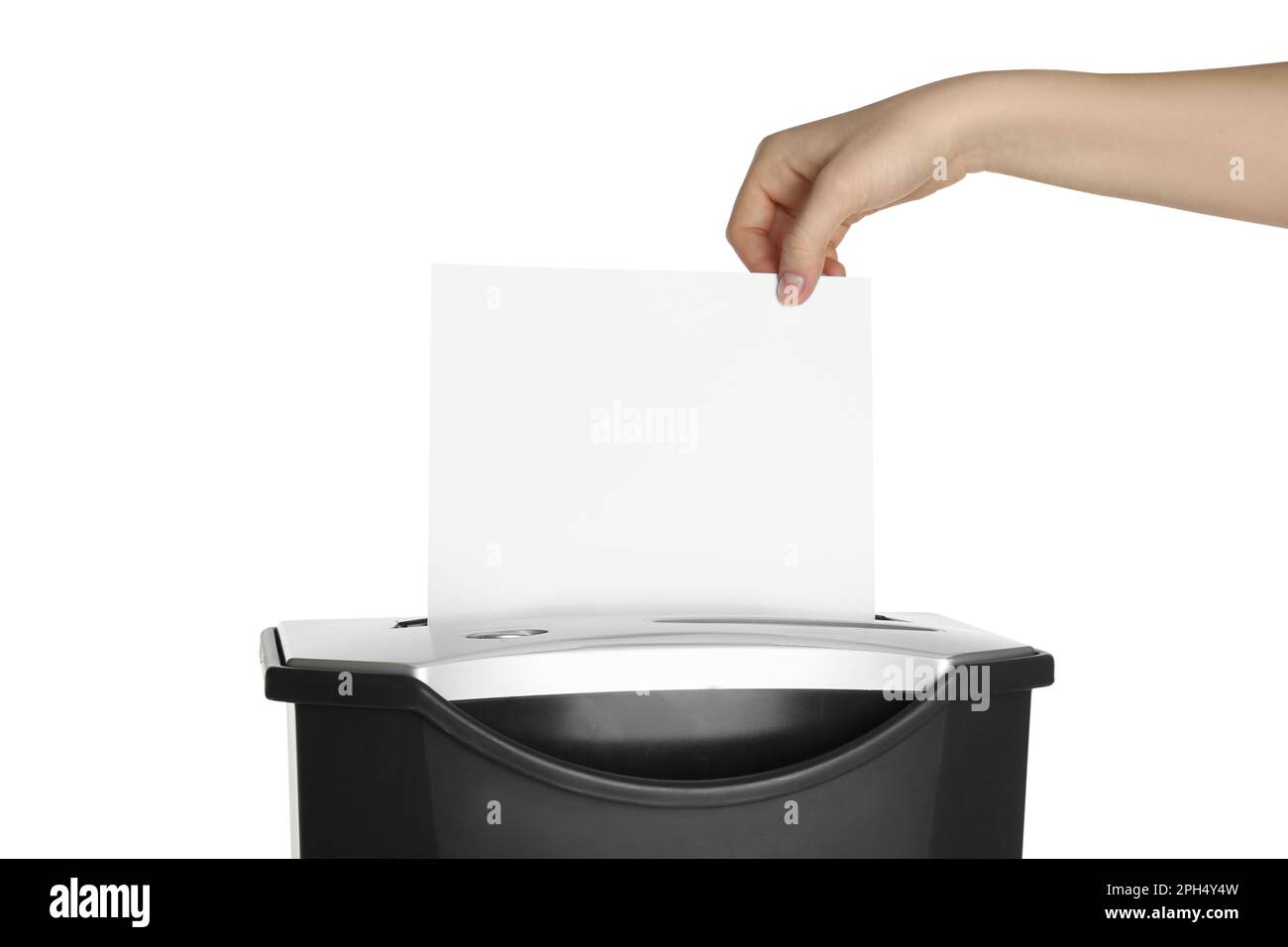 Woman destroying sheet of paper with shredder on white background ...