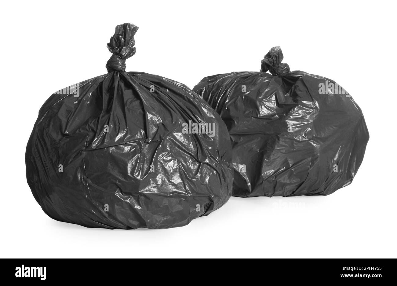 Black trash bags full of garbage on white background Stock Photo - Alamy