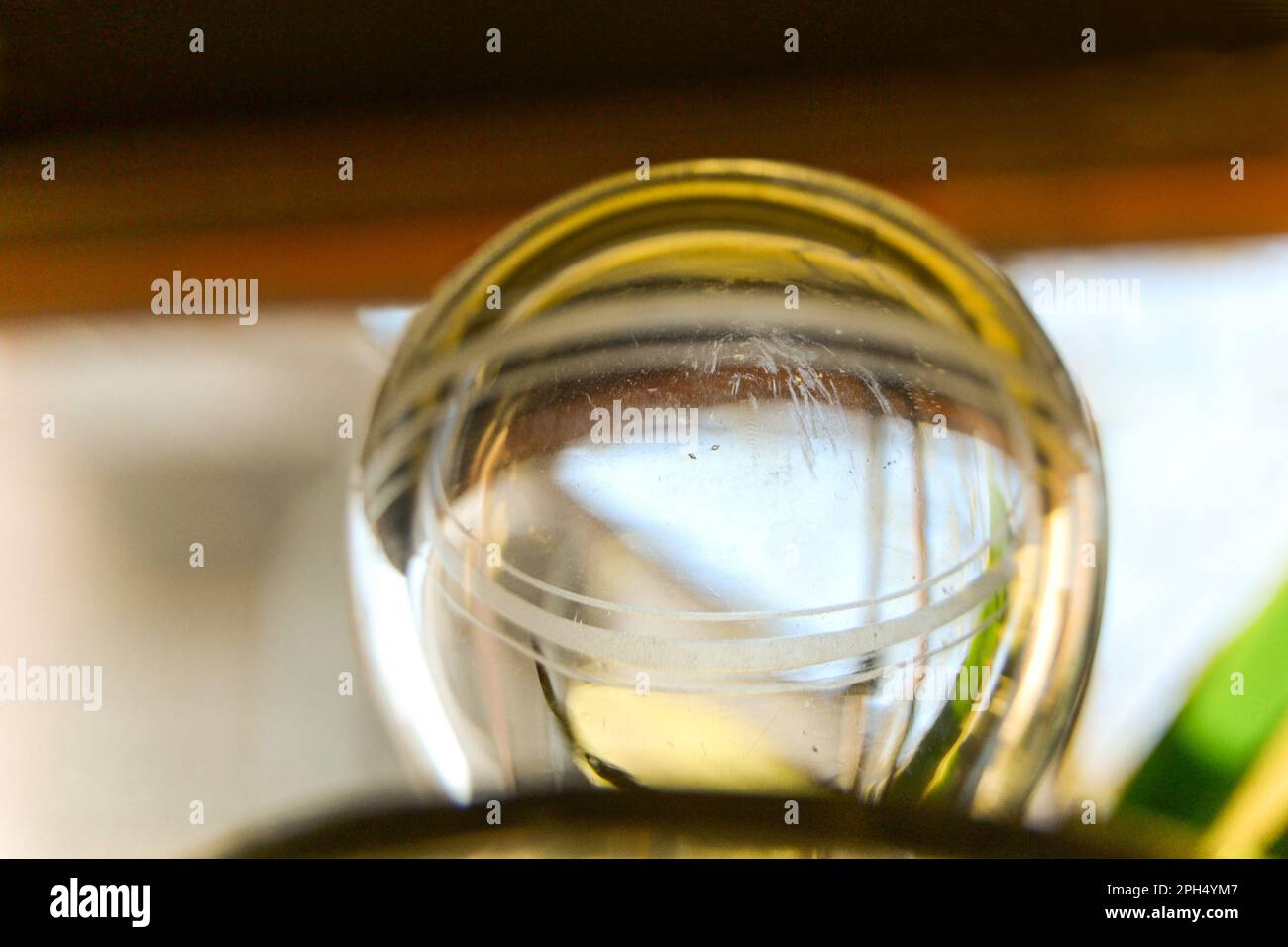 Top of a transparent glass bottle on a shelf with beautiful natural ...