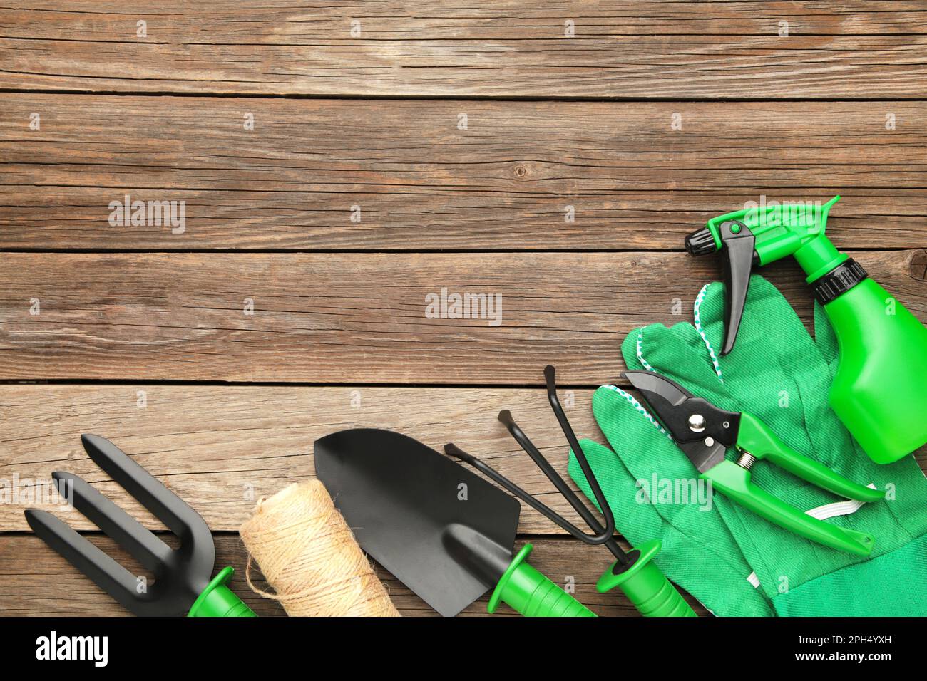 Gardening tools on grey wooden background with space for text Stock ...