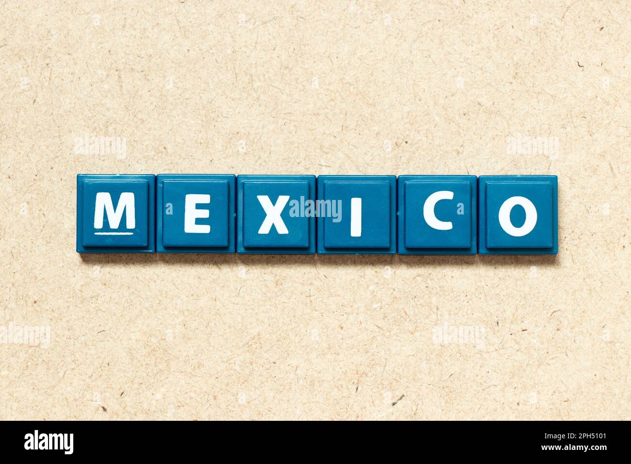 Tile alphabet letter in word mexico on wood background Stock Photo - Alamy