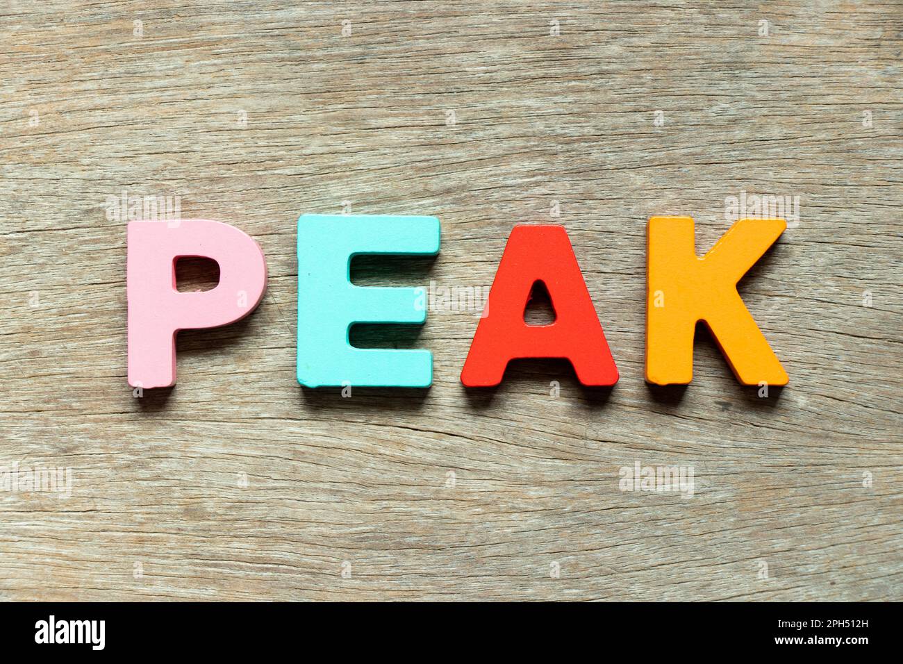 Color alphabet letter in word peak on wood background Stock Photo - Alamy