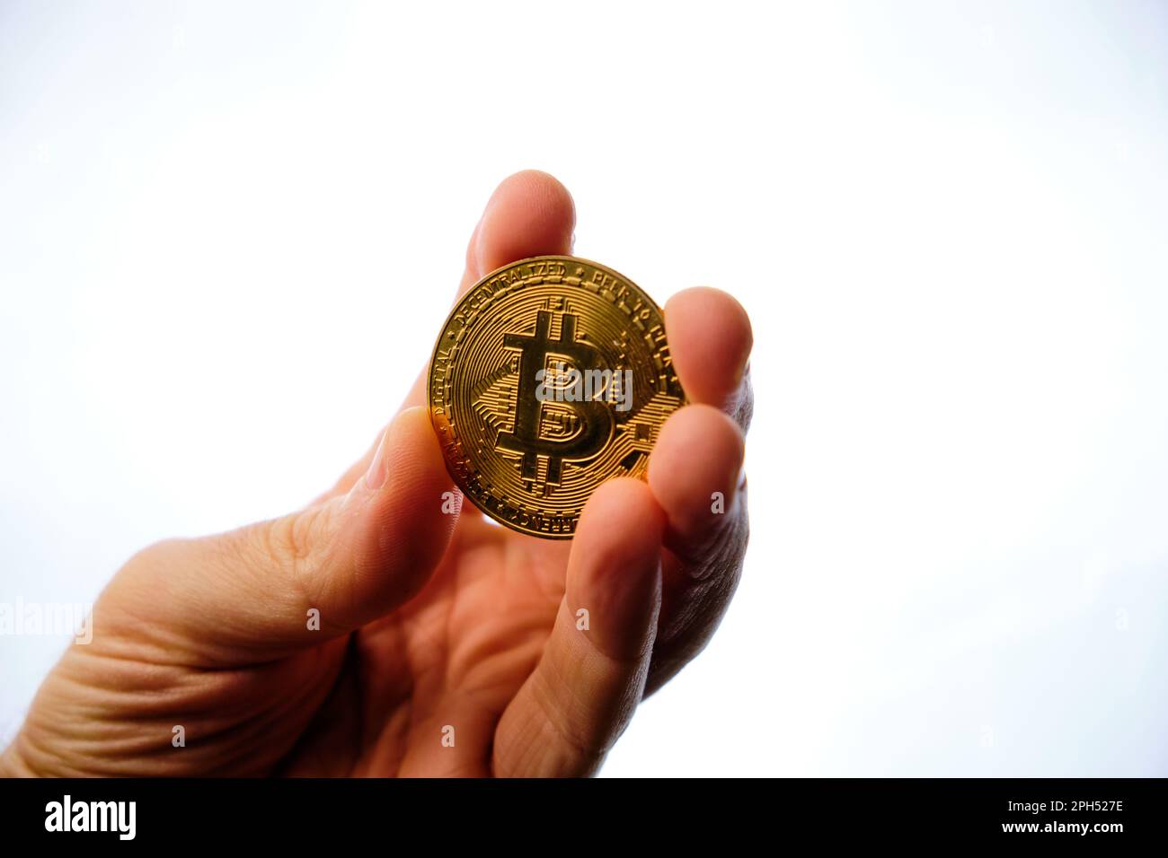 Hand businessman holding coin hi-res stock photography and images - Alamy