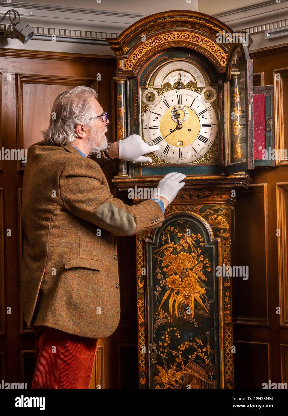 President of the British Horological Institute Alan Midleton, adjusts ...