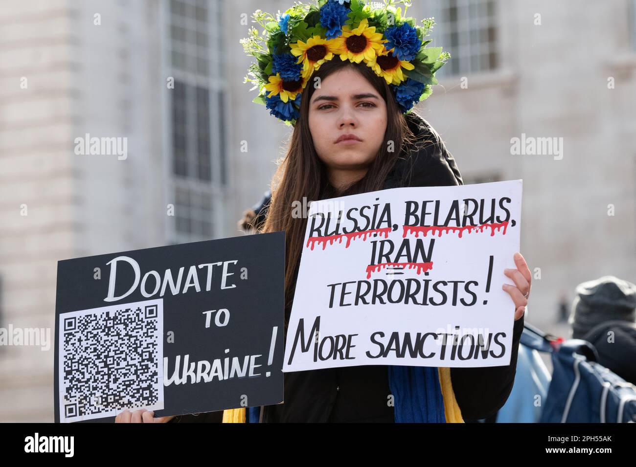 London, UK. 25 March, 2023. Ukrainian and Iranian women stage a joint ...