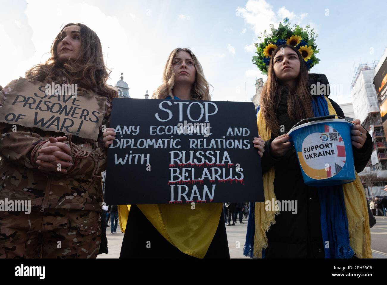 London, UK. 25 March, 2023. Ukrainian and Iranian women stage a joint ...