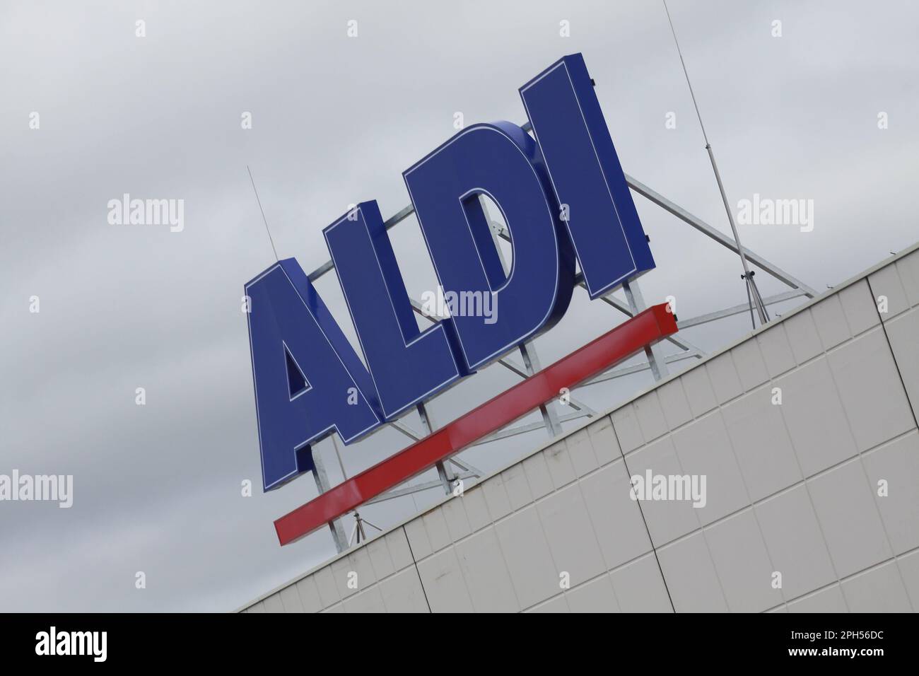 Aldi company sign at the Südring shopping center against a blue sky on ...