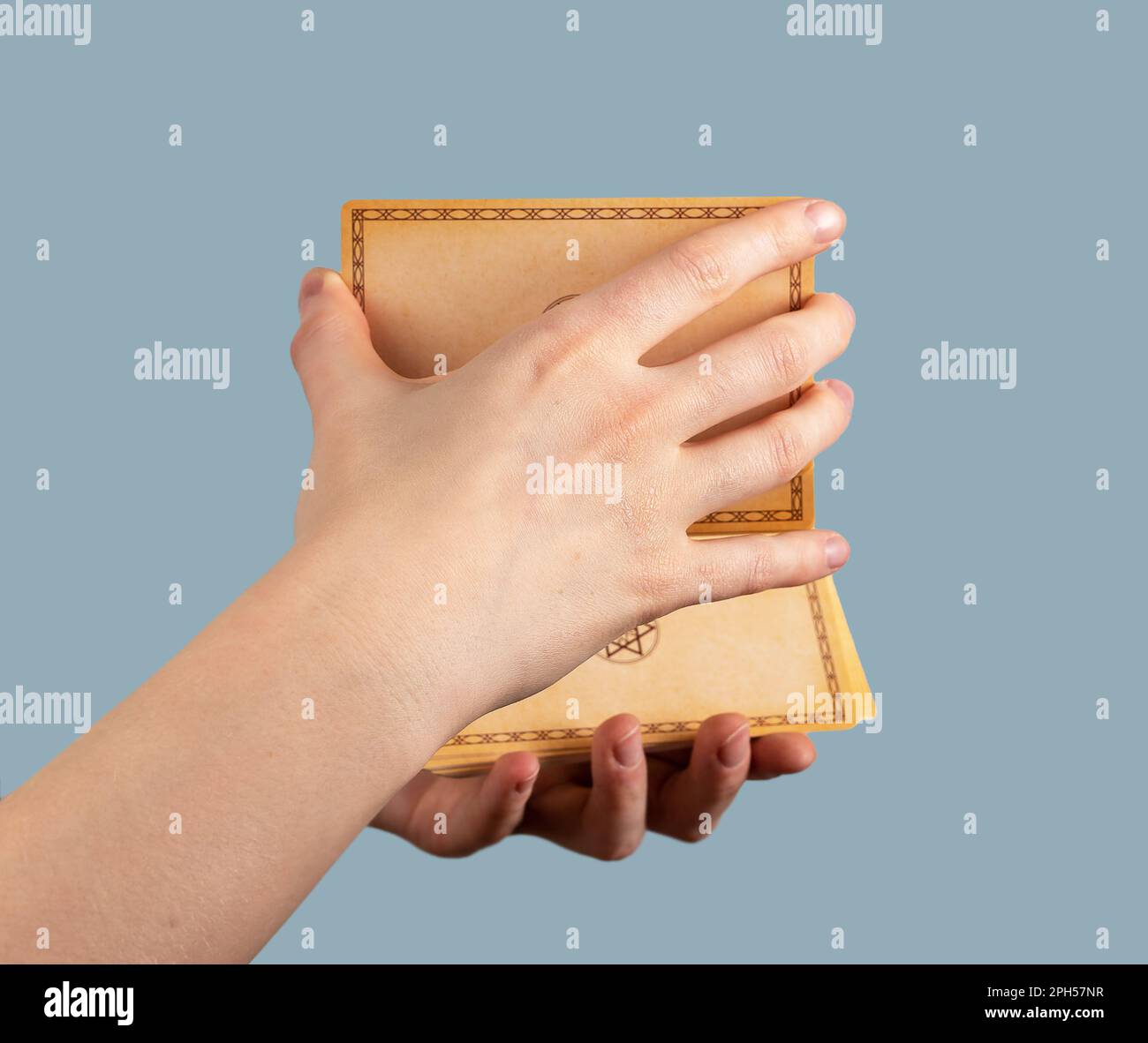 Hands shuffling tarot cards. Divination, fortune telling concept Stock ...