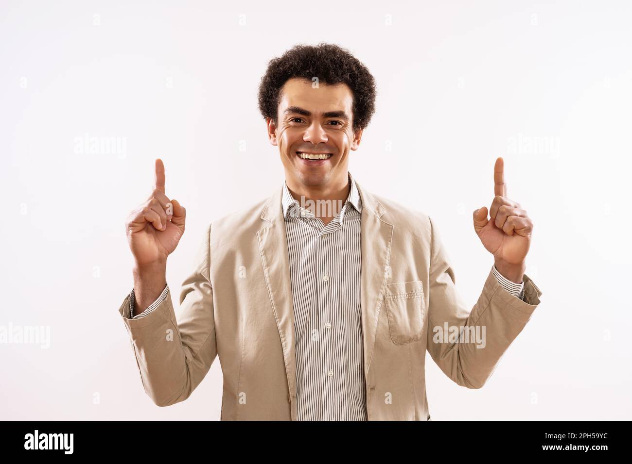 Portrait of happy businessman pointing Stock Photo - Alamy