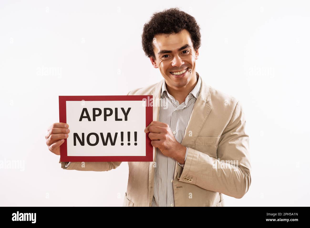 Image of businessman holding paper with text apply now Stock Photo - Alamy