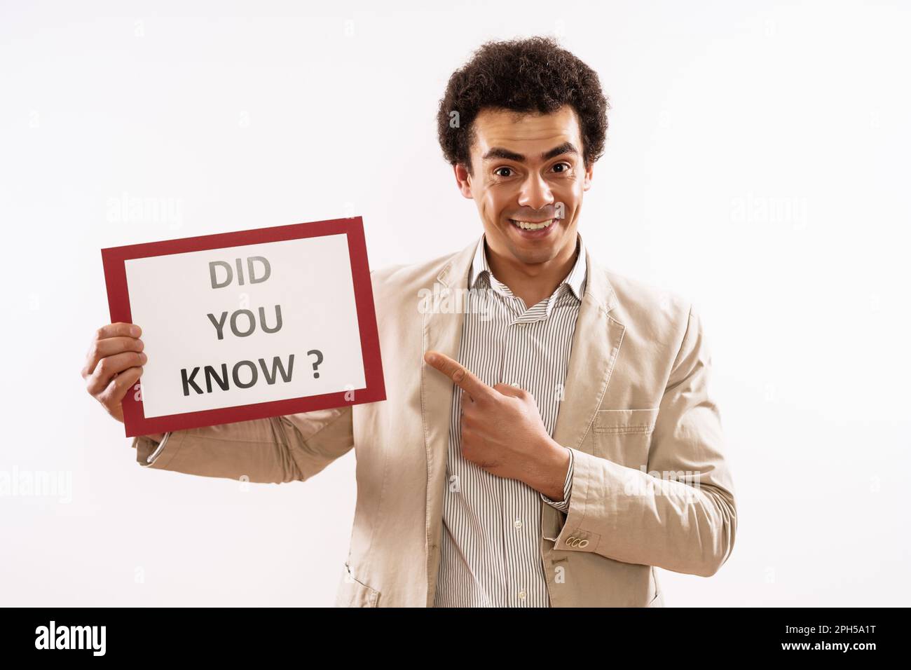 Image of businessman holding paper with question did you know Stock ...