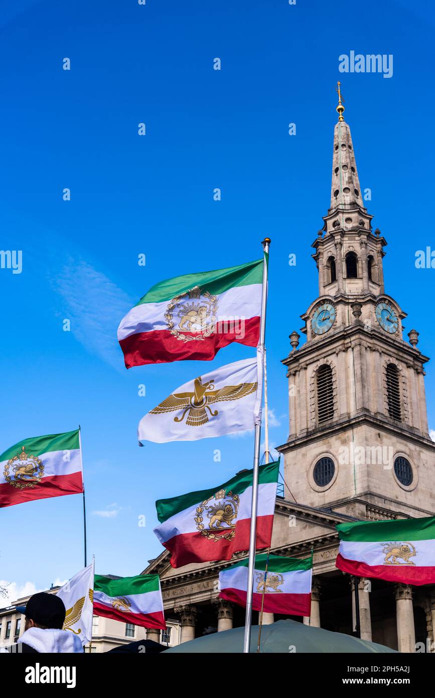 Old Iran Flags waving at Trafalgar Square in Iranian pro-democracy ...