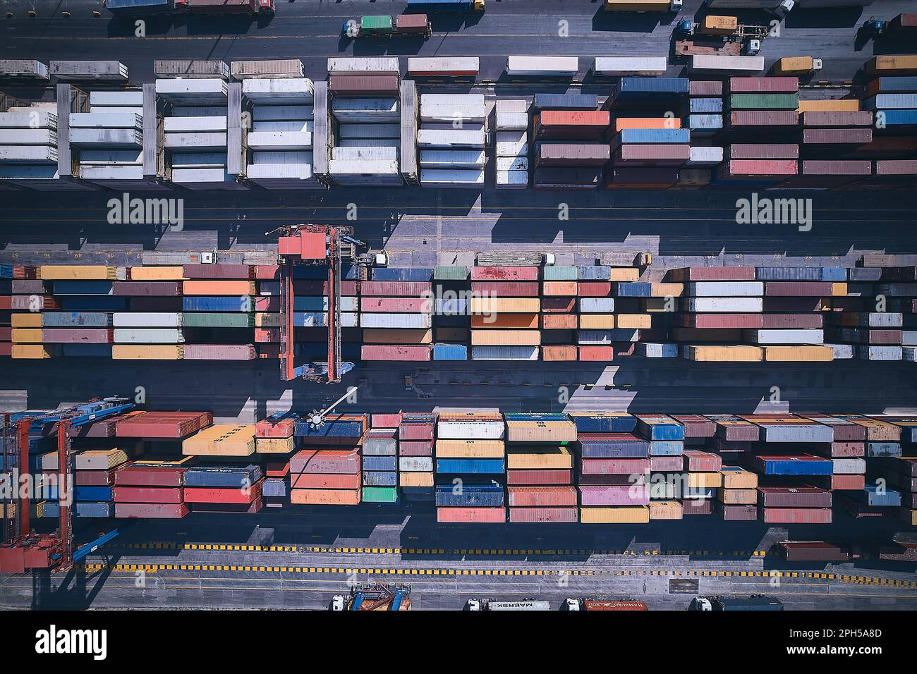 Stacked cargo containers top down aerial view. Containers at logistics terminal. Cargo container ...