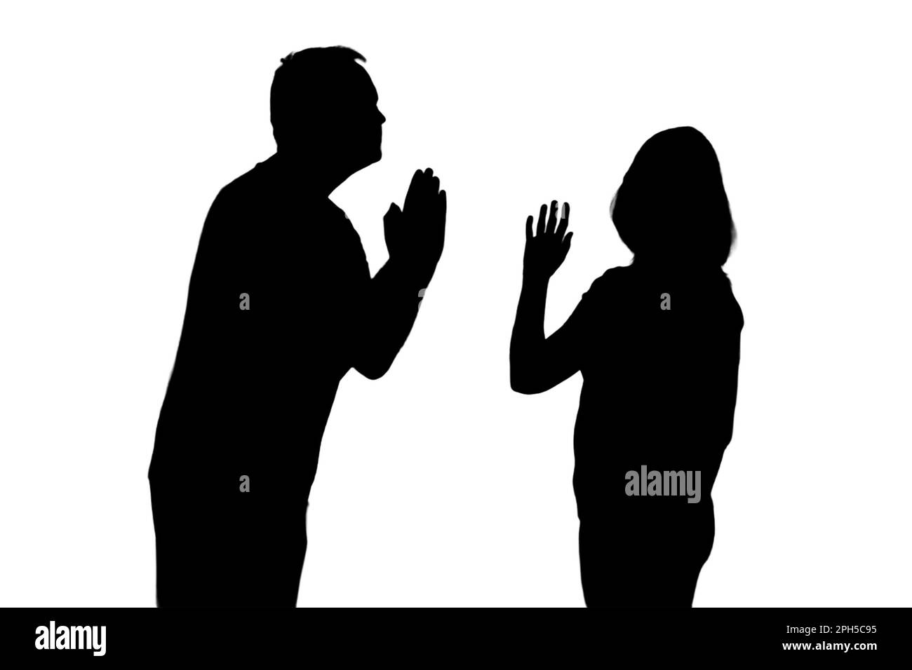 A man asks a woman for forgivenessisolated, isolated on a white ...