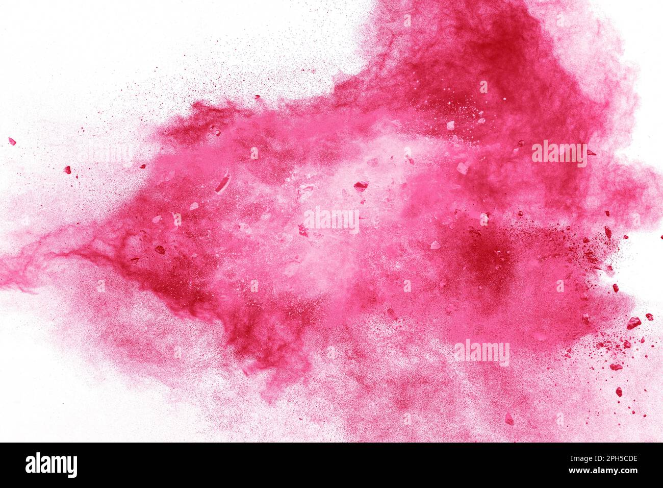 Split debris of stone exploding with pink powder against white ...