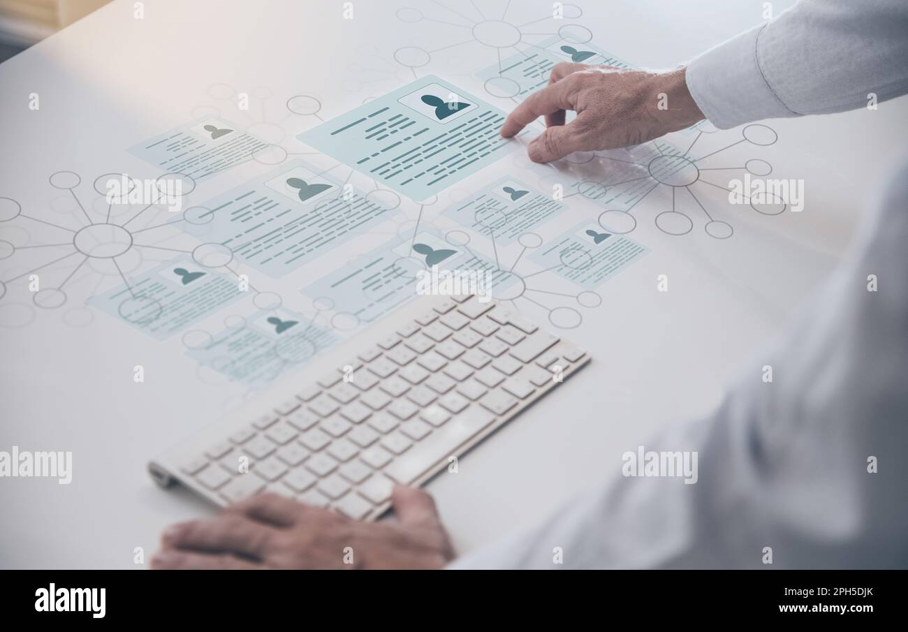 Manager checks CV on virtual display. Human resource employee choose ...