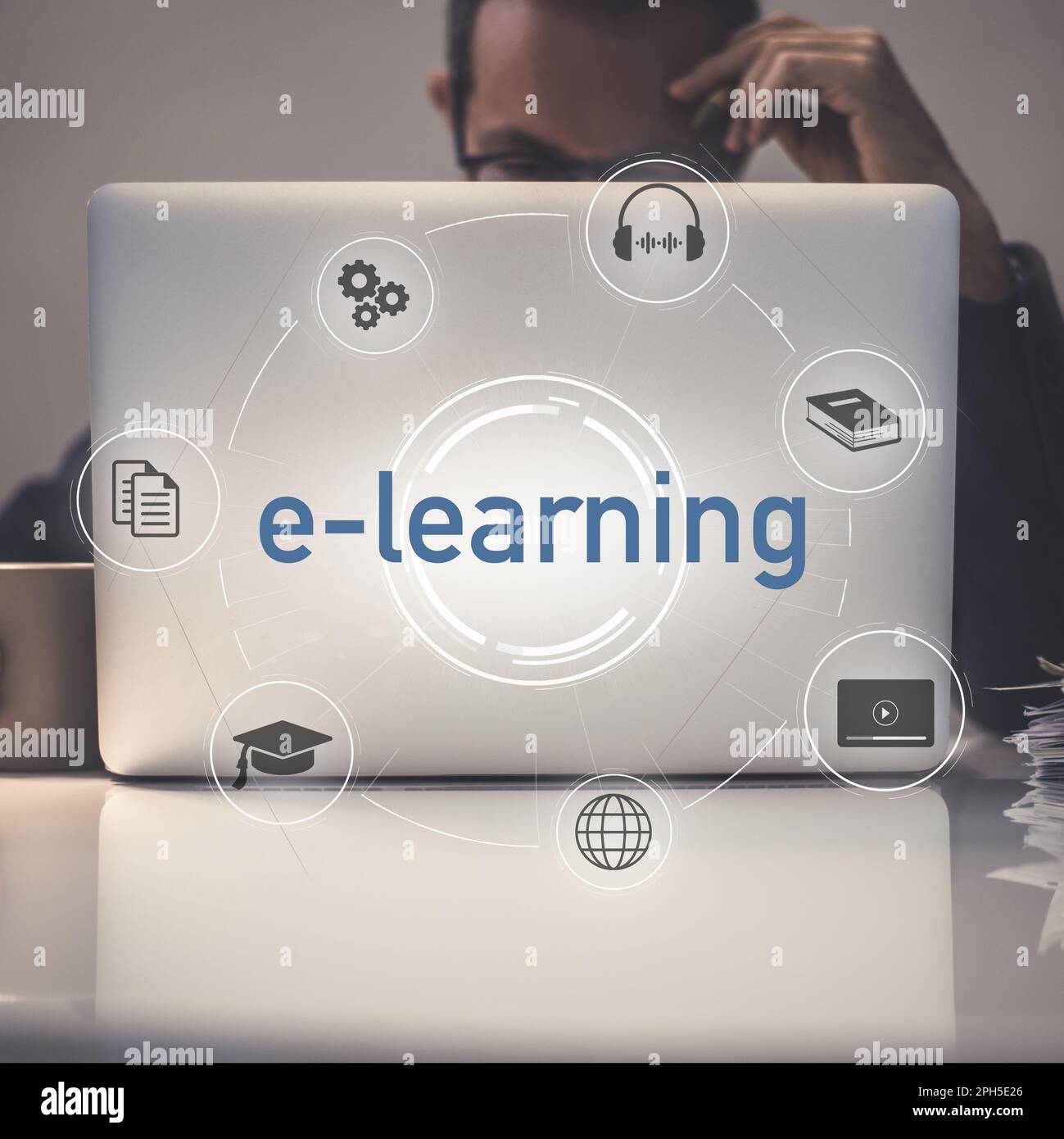 E-learning, education, study online concept. Man behind laptop on desk ...