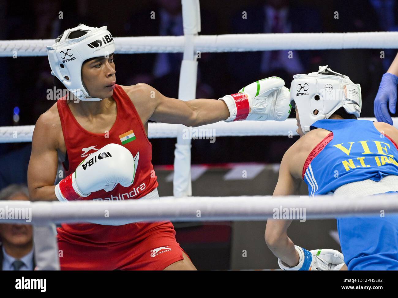 India's Nikhat Zareen, left, competes with Vietnam's Nguyen Thi Tam ...