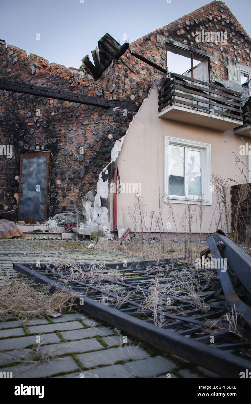 Destroyed building after russian invasion, Ukraine. Ruined facade of ...