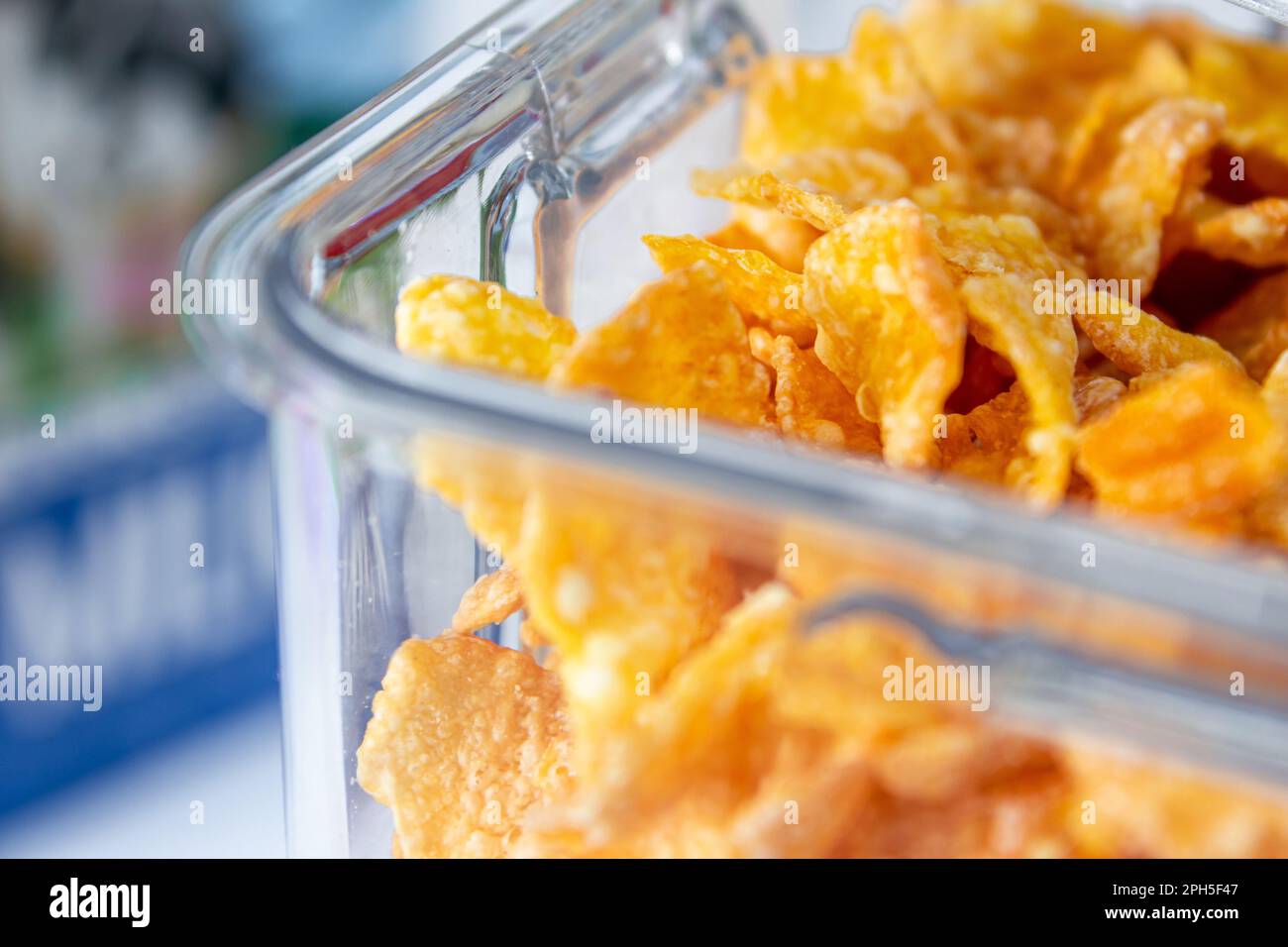 Close up view of the daily breakfast cereals in a jar. Cornflakes in a ...