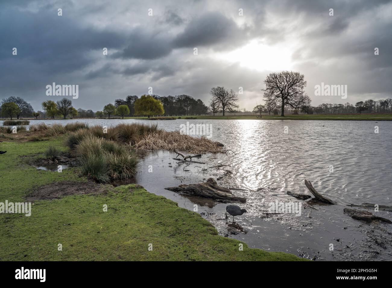 Sun breaking through the rainy sky in the last few days of March Stock ...