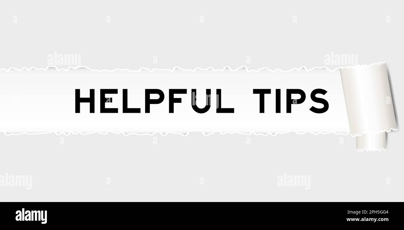 Ripped gray paper background that have word helpful tips under torn ...