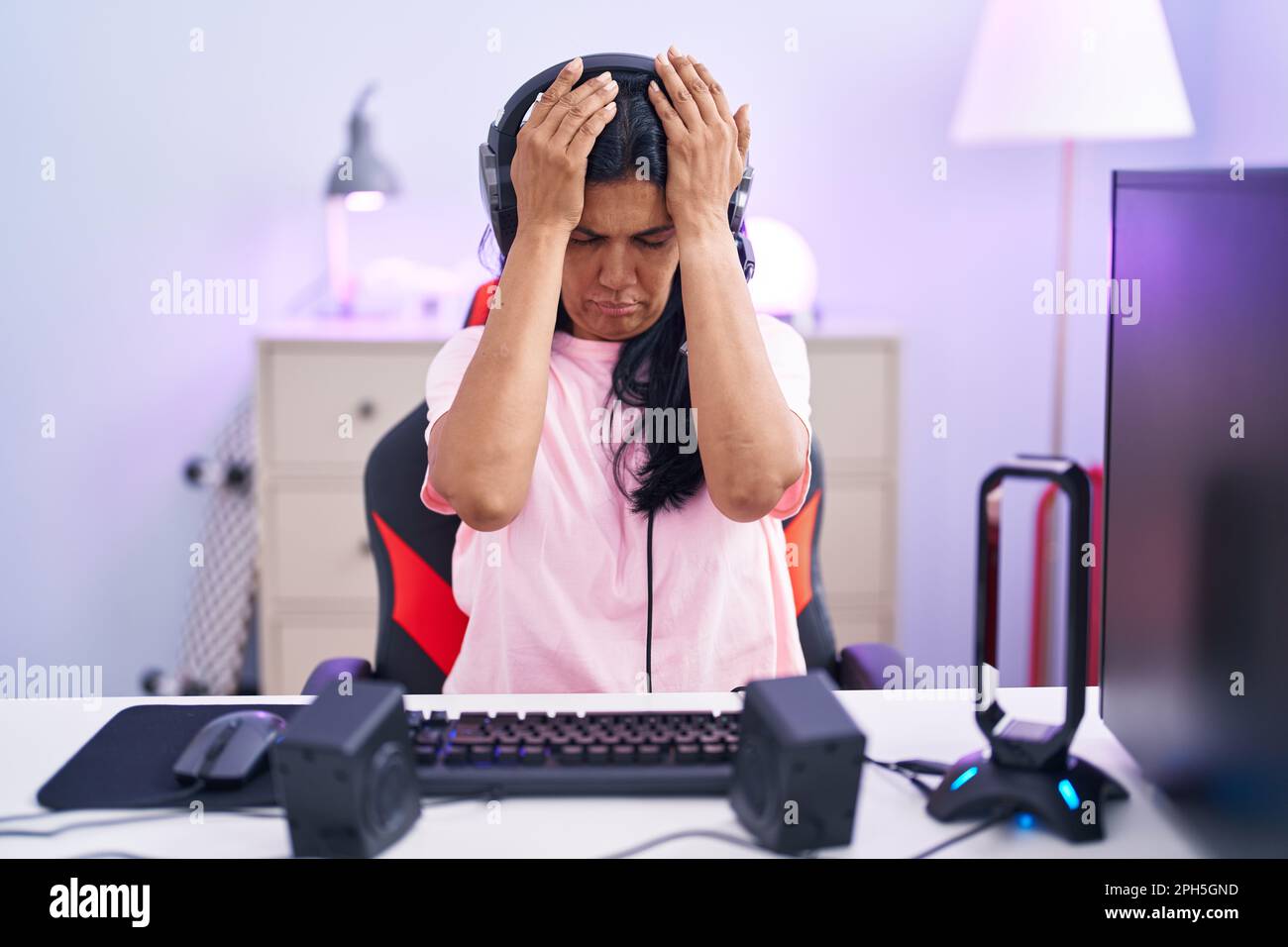 Tired female gamer playing video games hi-res stock photography and ...